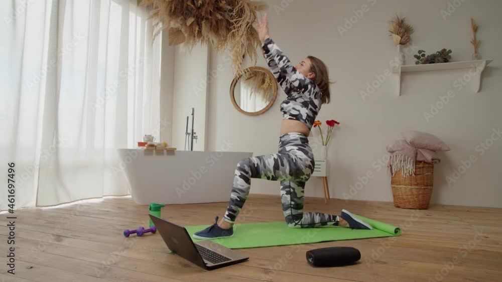 Active pretty sporty fit female practicing low lunge in crescent moon ...