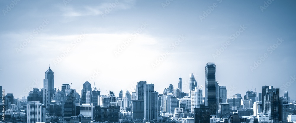 Blue-filtered cityscape and high-rise buildings in metropolis city ...