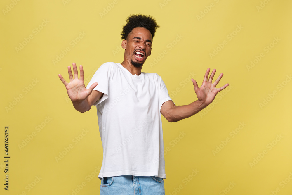 Portrait furious angry annoyed displeased young man raising hands up to ...