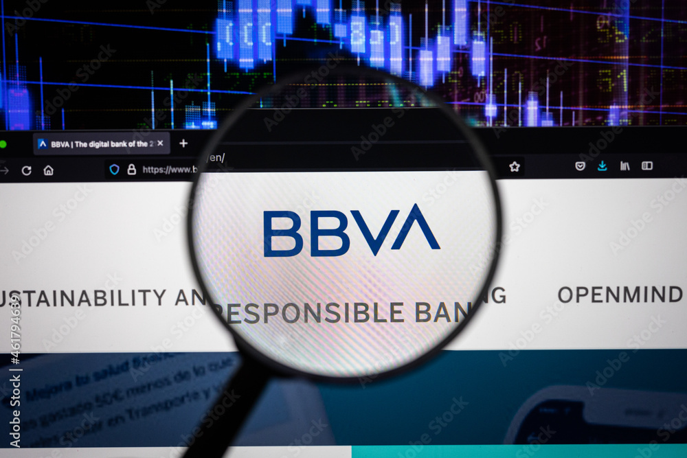 BBVA company logo on a website with blurry stock market developments in ...