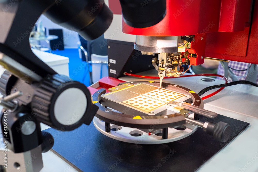 Microprocessor under microscope. Microprocessor testing equipment ...