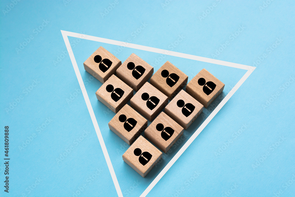 Blocks of people are joined together in a triangle. Combining efforts ...