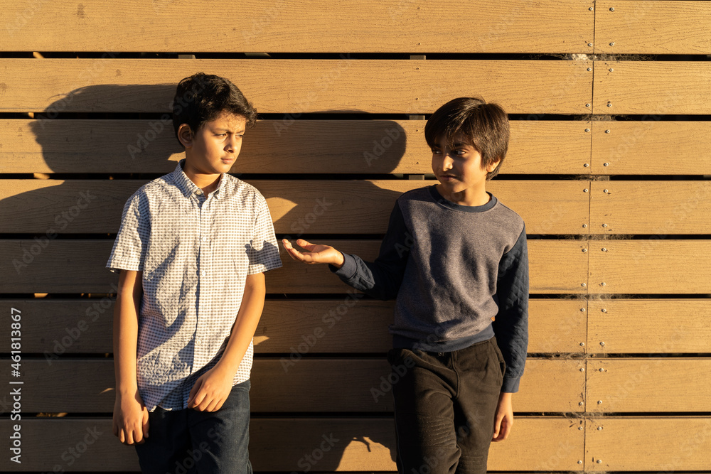 Asking for help concept. Two young boys friendship scene. South Asian ...