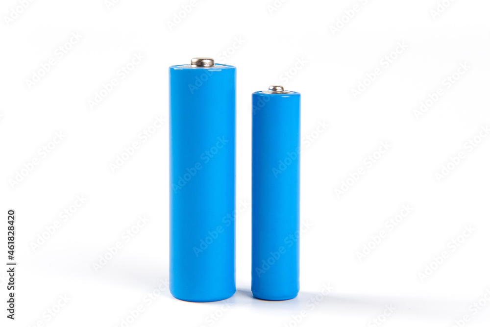 two blue Different types of batteries isolated on white background ...