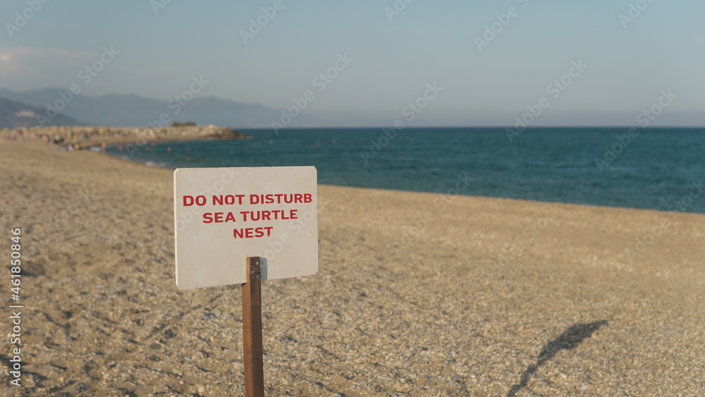 Do not disturb. Sea turtle nest. Sea turtle nest warning sign on the ...