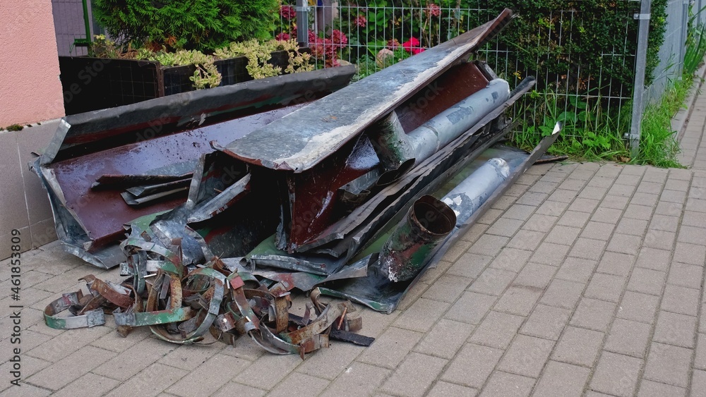 Pile of Scrap Metal Sheets and Rain Gutters From Roof Renewal ...