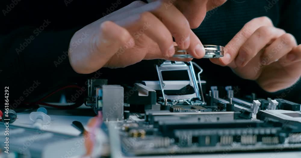 Technician Man Repairs PC by Studying with Magnifier and Fixing CPU ...