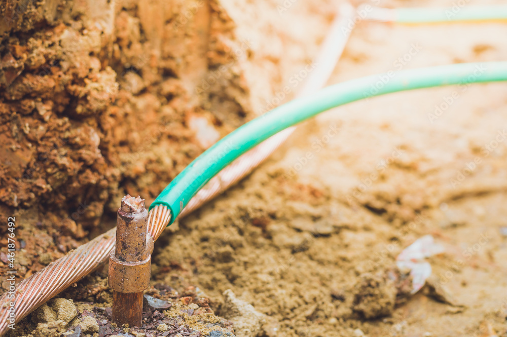 Welding copper ground wire on ground rod.Welding copper ground wire ...