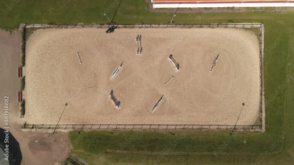 Aerial top down view of brown horse and rider walking slowly in the ...