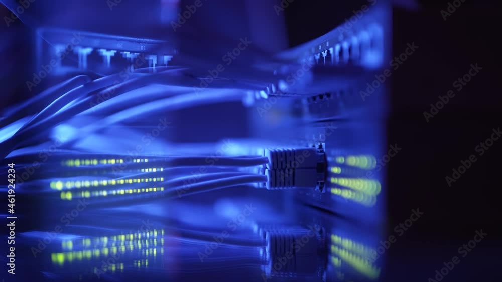 Close up fiber optic in server room. Network cables installed in the ...