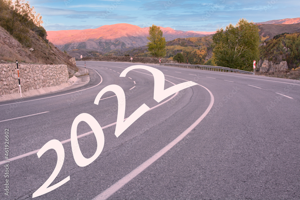 Start 2022 written on highway road in the middle of empty asphalt road ...