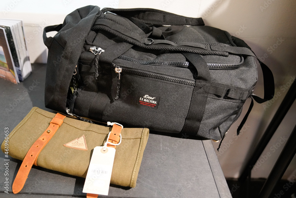 Deus different bags luggages for sale in the store with text logo and ...