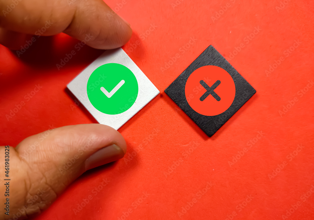 Colored wooden board with a correct sign and one incorrect sign. the ...