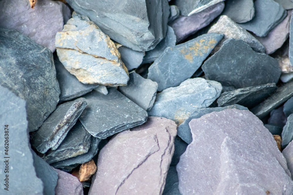 Raw rocks and minerals as natural stones background with crushed and ...