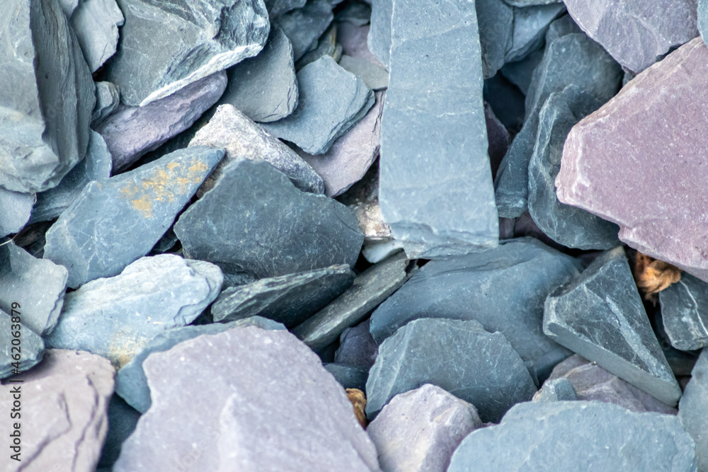 Raw rocks and minerals as natural stones background with crushed and ...