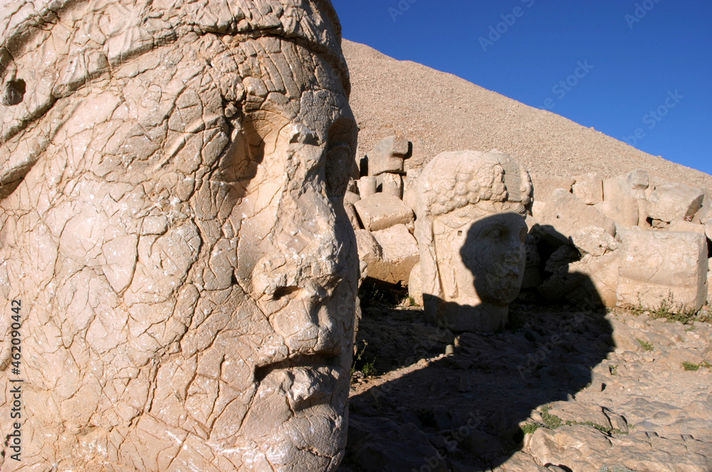 King Antiochus Statue detail and Mount Nemrut colossal statues guarding ...