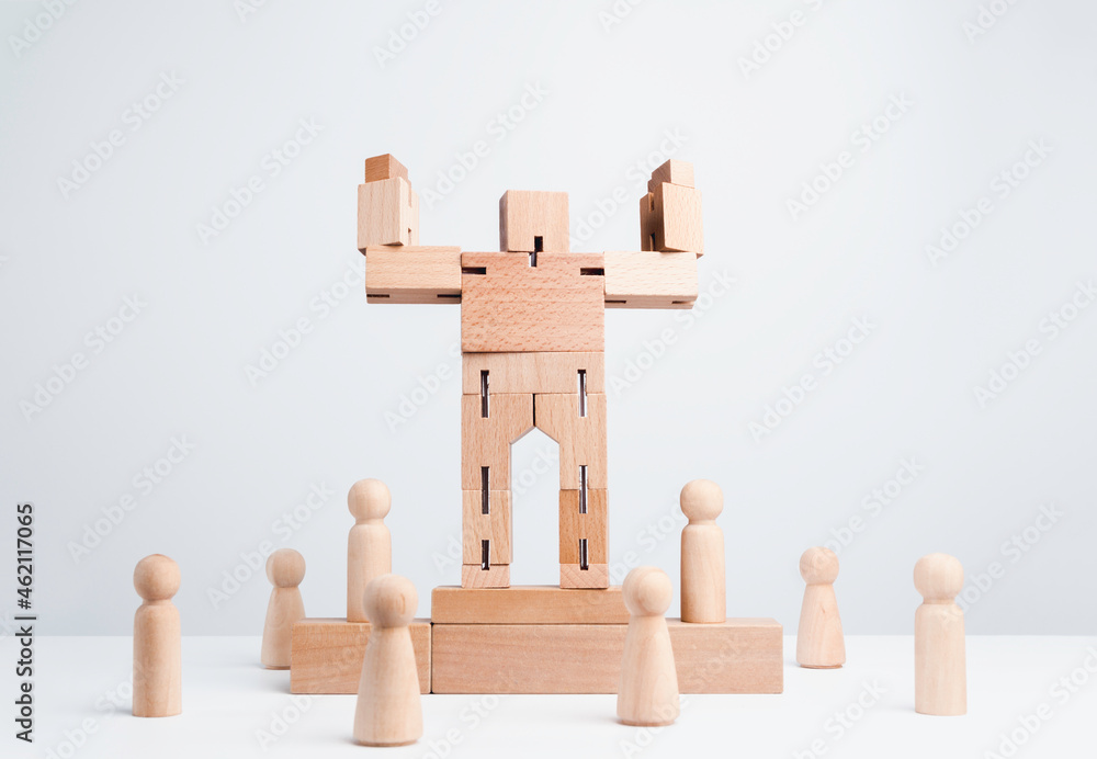 Big wooden robot strong power gesture standing on winner podium among ...