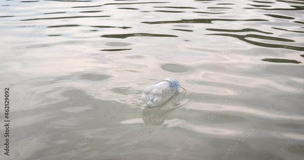 Single use plastic in ocean. A view of single use plastic bottle in the ...