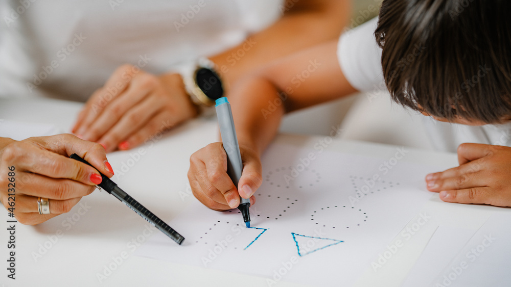 Child drawing shapes in a preschooler assessment test. Stock Photo ...