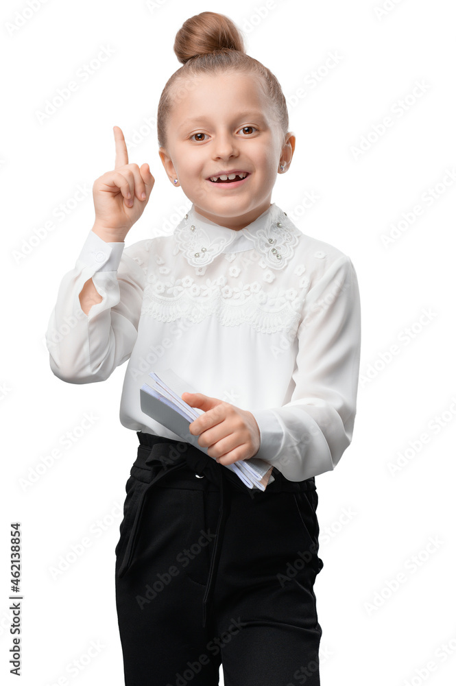 A smiling blonde elementary school student in a school uniform holds ...