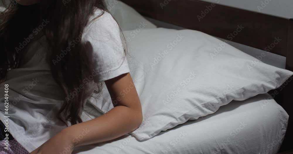 Close up of little girl 6 years old with long brown hair falling asleep ...