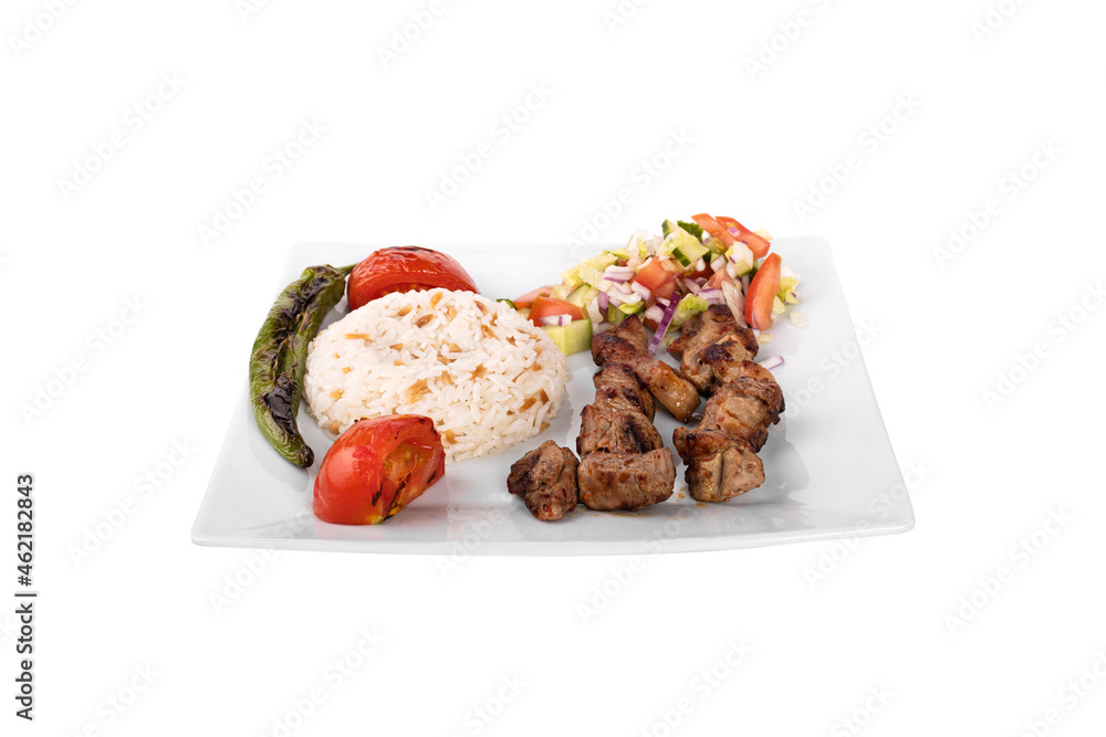 Turkish kebab lamb meat on skewer. with vegetables, rice in a porcelain ...