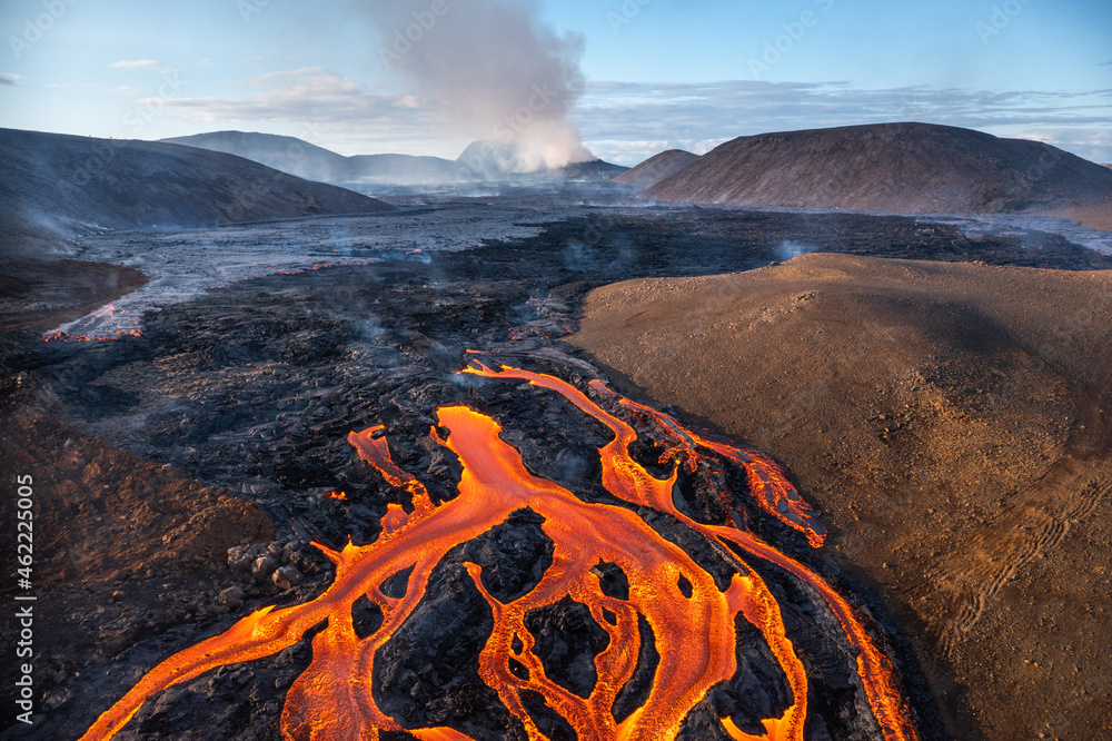 Volcanic eruption. Fresh hot lava, flames and poisonous gases going out ...