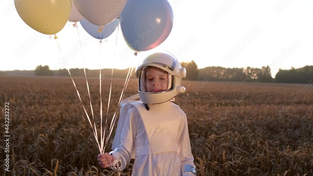 Little young happy child boy wearing astronaut uniform and helmet ...
