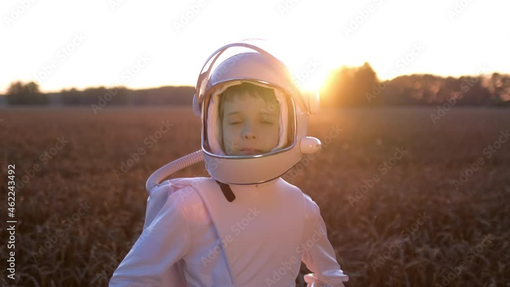 Portrait of little young child boy wearing astronaut uniform, helmet ... Portrait of little young child boy wearing astronaut uniform, helmet ...