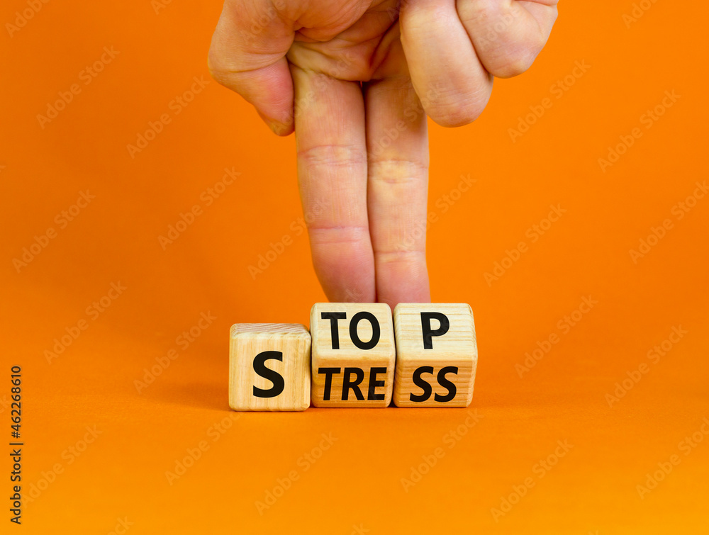 Stop stress and be health symbol. Doctor turns wooden cubes and changes ...