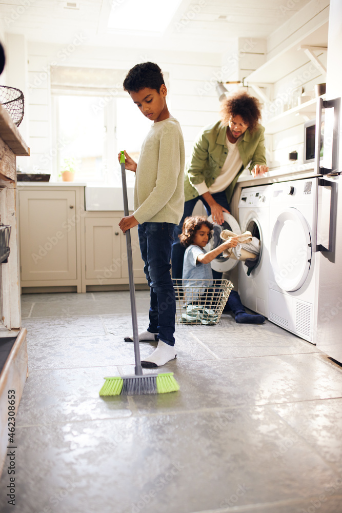 Two boys helping father with household chores Stock Photo | Adobe Stock