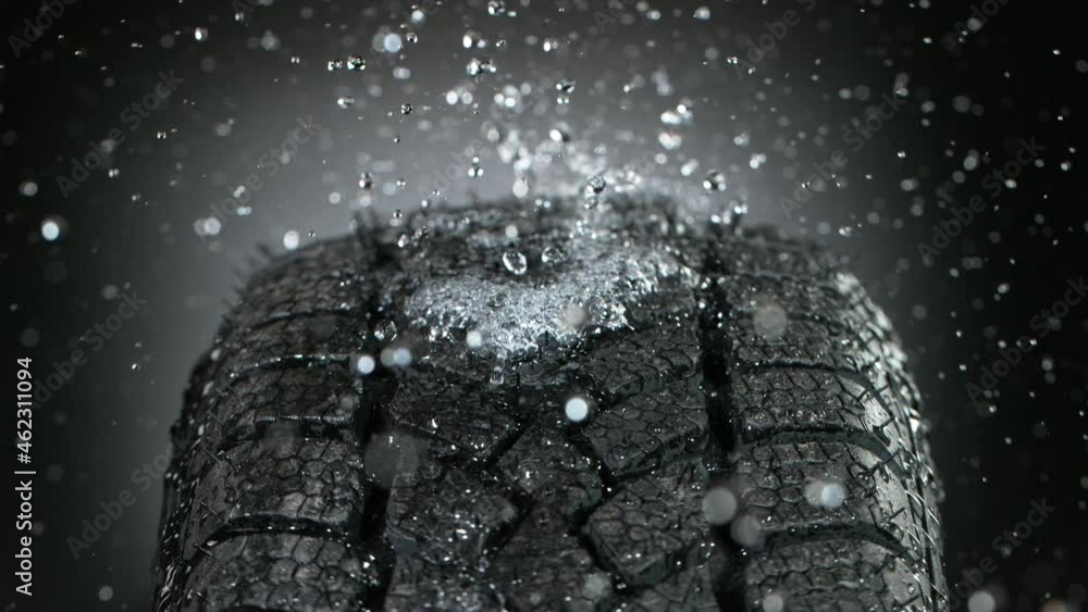Super Slow Motion of Car Tire with Water Splash, Isolated on Black ...