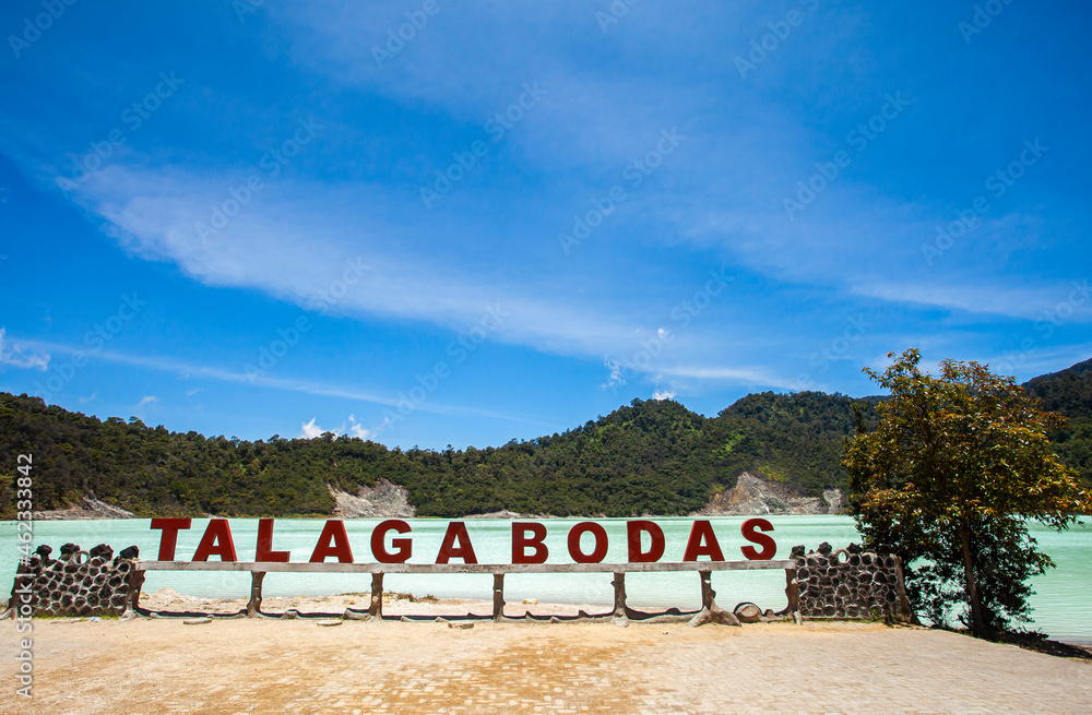 Stunning view of the Talaga Bodas Lake surrounded by a green tropical ...
