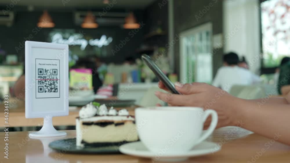 pay online scan QR code.Women using their phones for scanning to pay ...