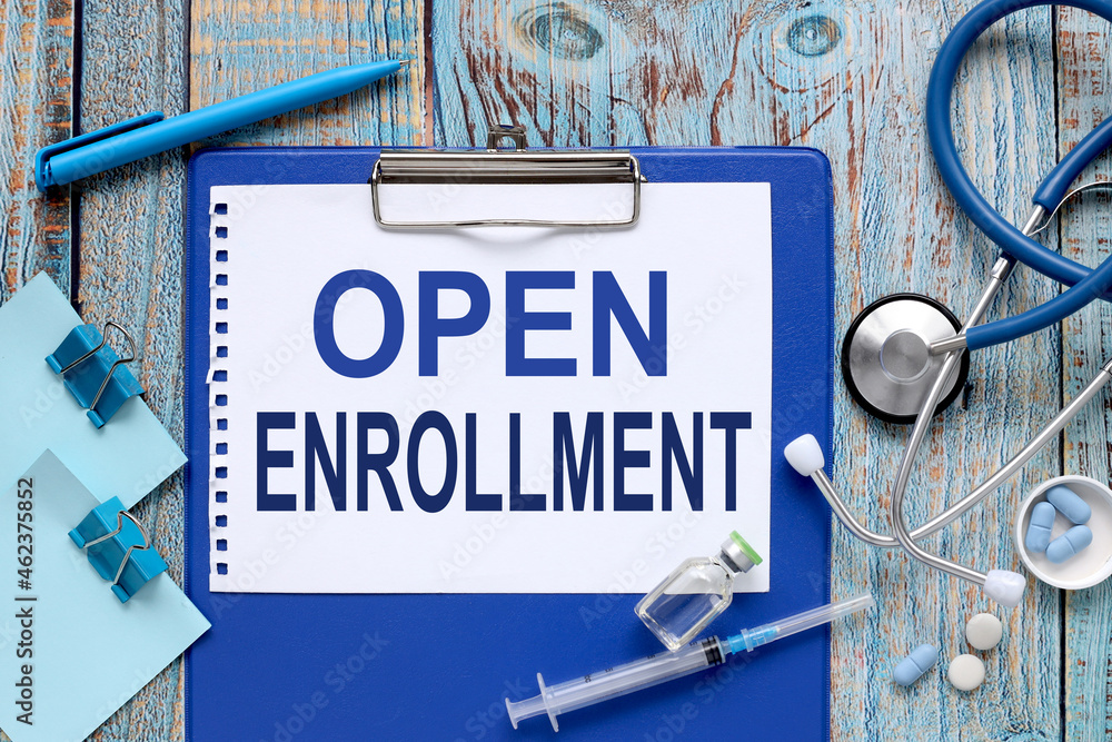 Open Enrollment. ampoules, tablets. stethoscope, notepad on the doctor ...