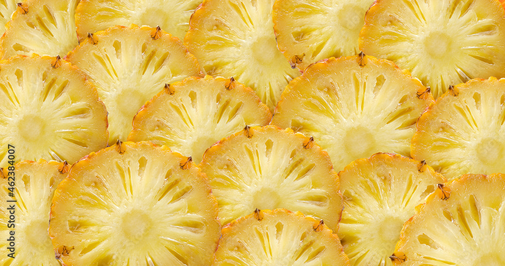 Many round pineapple slices top view. Background for banner design ...
