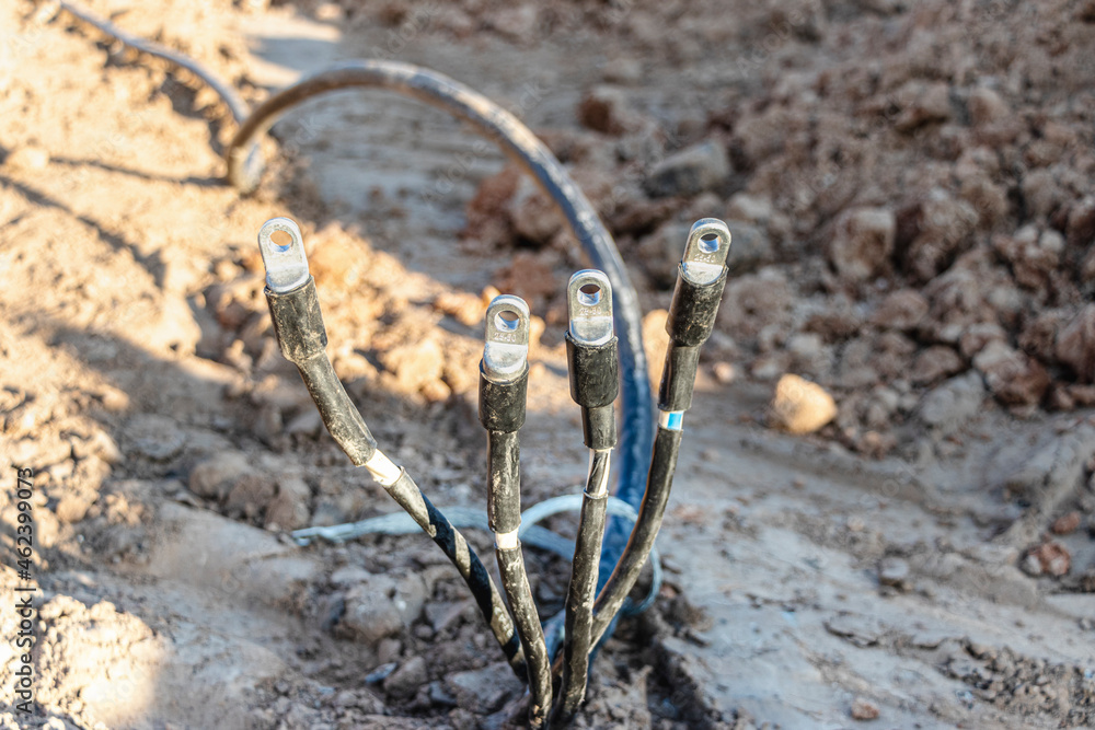 The ends of the electrical cable in the trench. Electrical cable ...