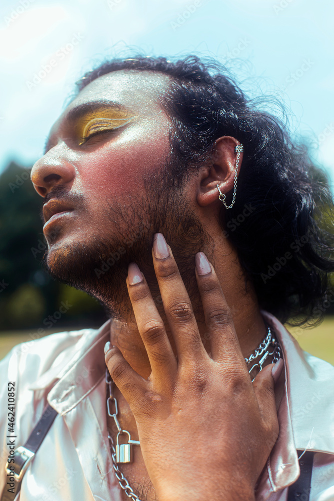 dreamy portrait of a dark skinned Indian man in Malaysia, with make up ...
