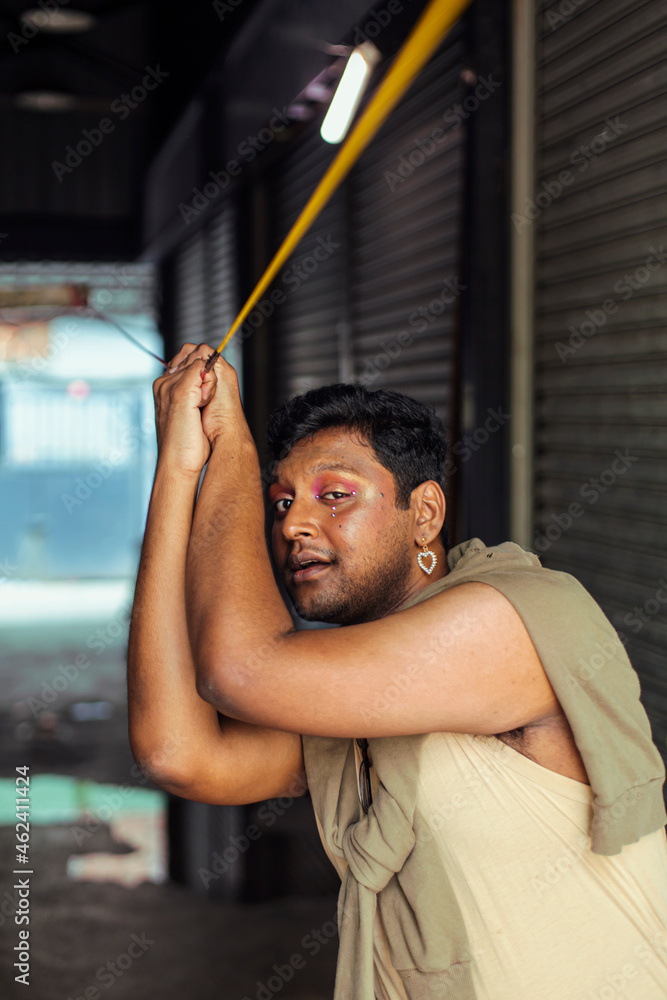 portrait of dark skinned Indian man in Malaysia, with theatrical facial ...