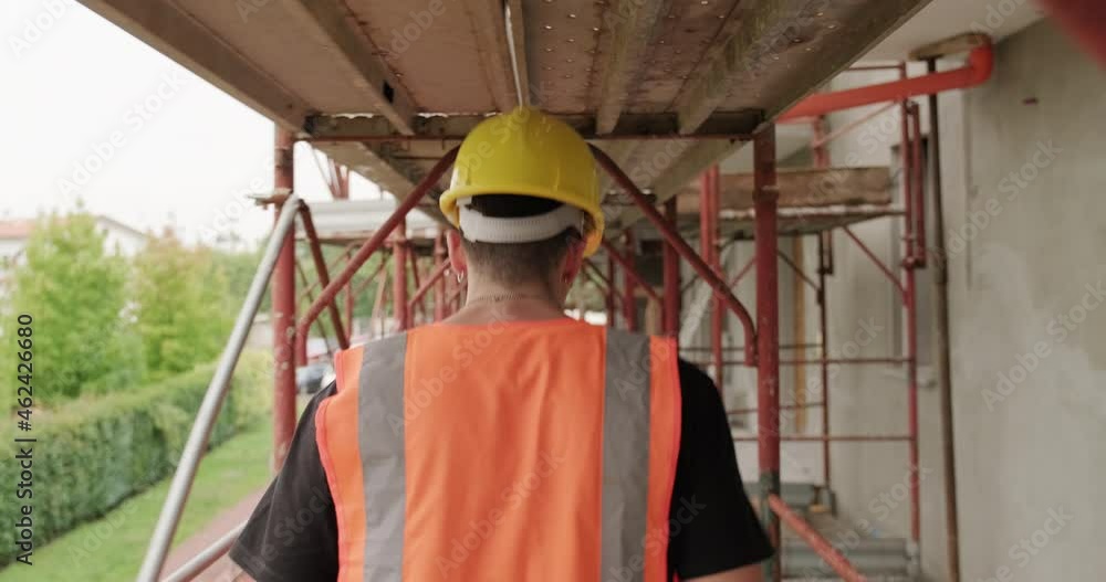 People working in construction site. Men at work in new house inside ...