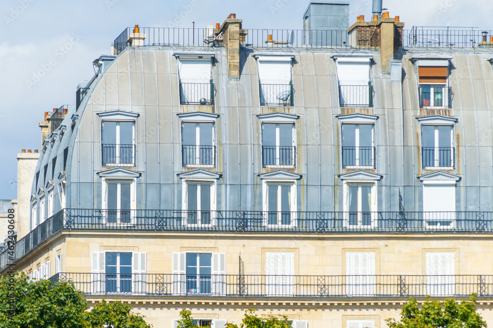 Typical architecture of Paris in France. The building roofs are curved ...
