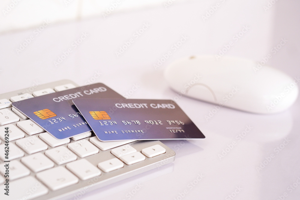 Credit card on computer keyboard on white desk. Concept of Online ...
