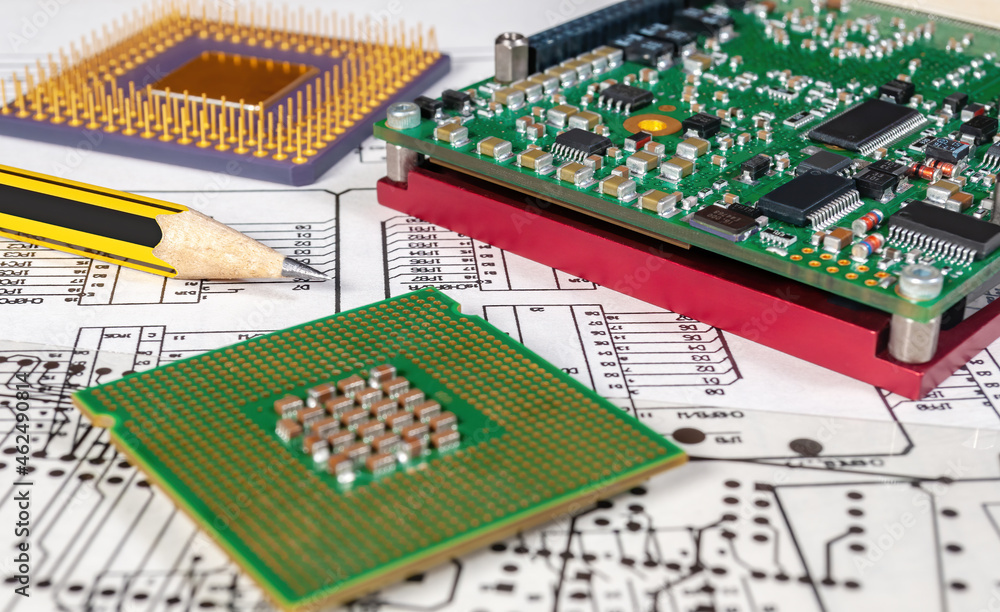 Electronic board, pen, and processors on background of schematic ...
