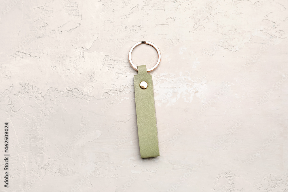 Leather keychain on light background Stock Photo | Adobe Stock
