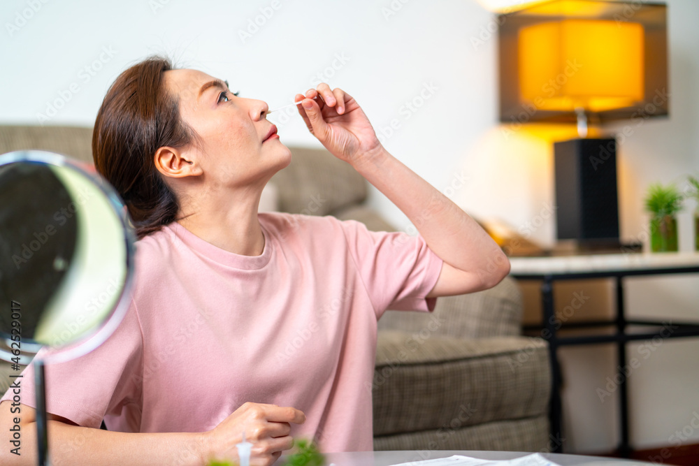 4K Asian woman using rapid antigen test kit for self test COVID-19 ...