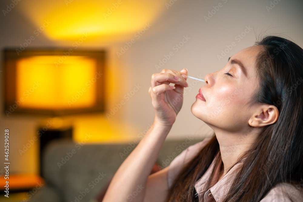 4K Asian woman using rapid antigen test kit for self test COVID-19 ...