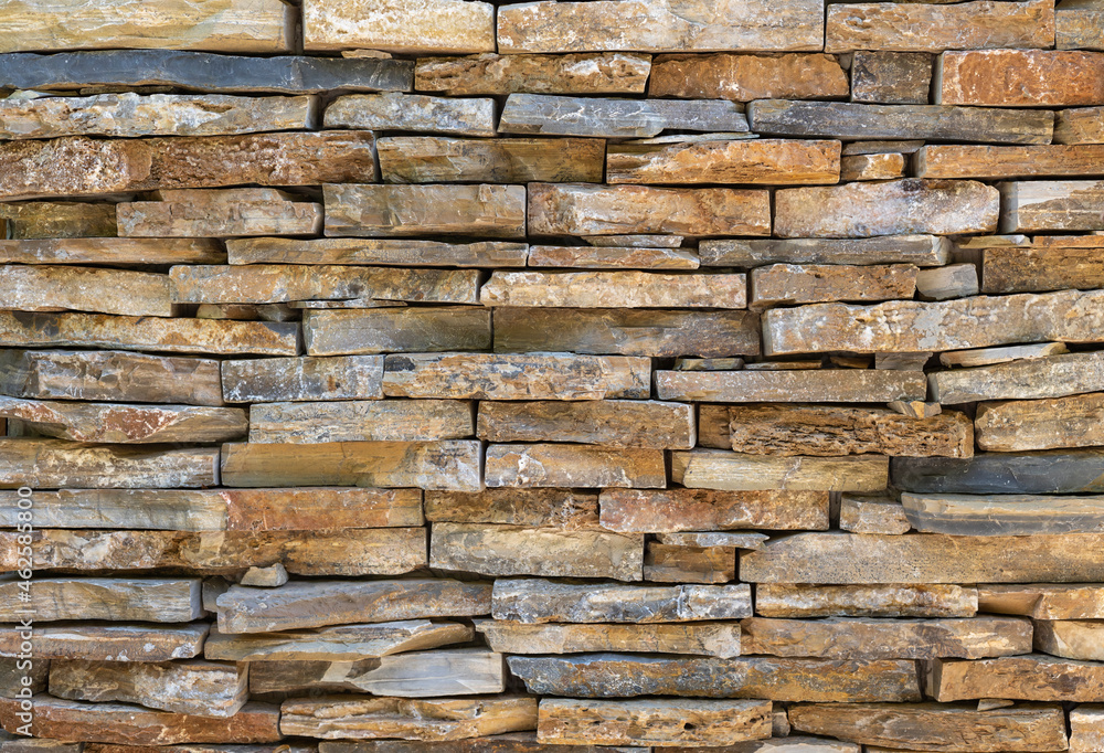 Texture of the facade cladding with natural stone gray sandstone. Stock ...