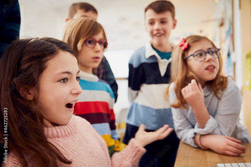 Children learning on a computer in classroom Stock Photo | Adobe Stock
