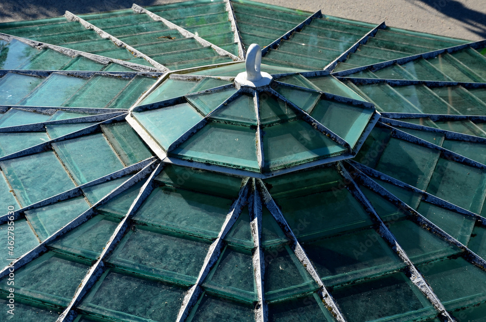 polygonal window at ground level in the shape of a hexagonal pyramid ...