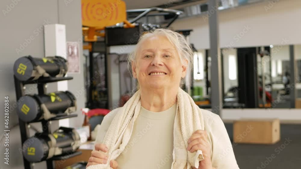 Portrait old woman in gym. Physical culture for older people. Training ...